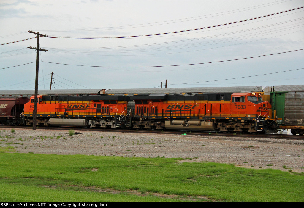 BNSF 7083 Waits to get an okay to depart the NS yard.